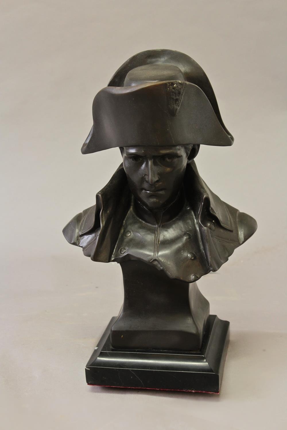 A BRONZE BUST OF NAPOLEON, head and shoulders, wearing his hat and with ...