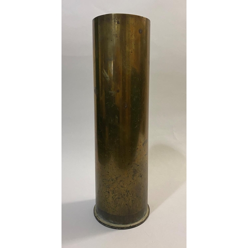 A 12 POUNDER SHELL CASE. A brass 12 pounder Naval shell case... | Barnebys