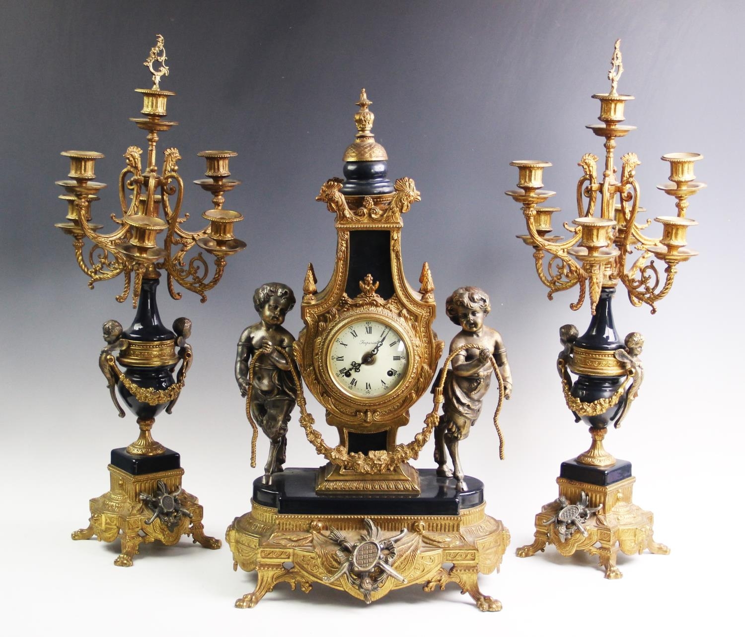 An Italian Brevettato Imperial gilt metal clock garniture, 20th century ...