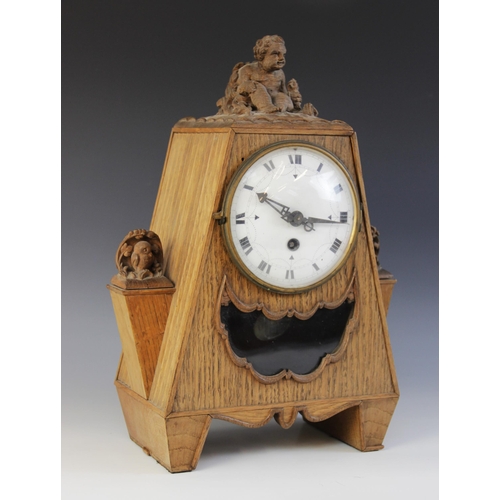 A Bavarian oak cased carved mantel clock, early 20th century... | Barnebys
