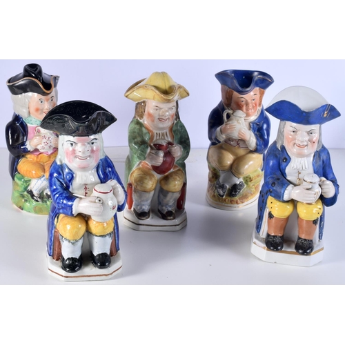 A collection of antique character jugs 28cm (5). | Barnebys