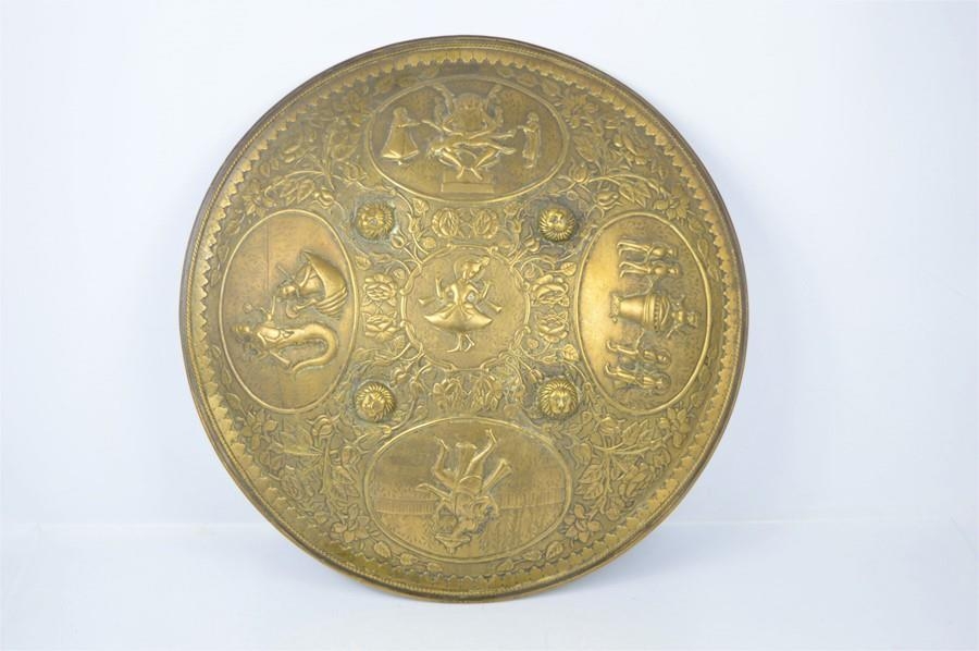 An Indian brass shield, circa 1900, embossed to depict the Lords of ...