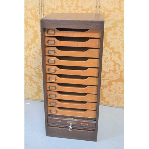 An early 20th century oak tambour filing cabinet, with key. | Barnebys