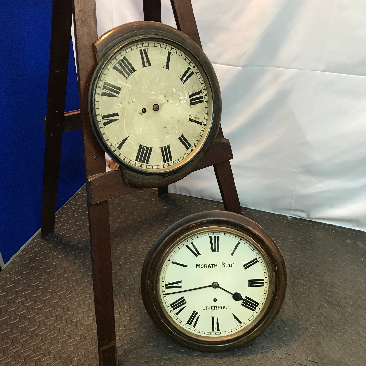 A Lot of two Antique wall clocks. One produced by Morath Bros ...