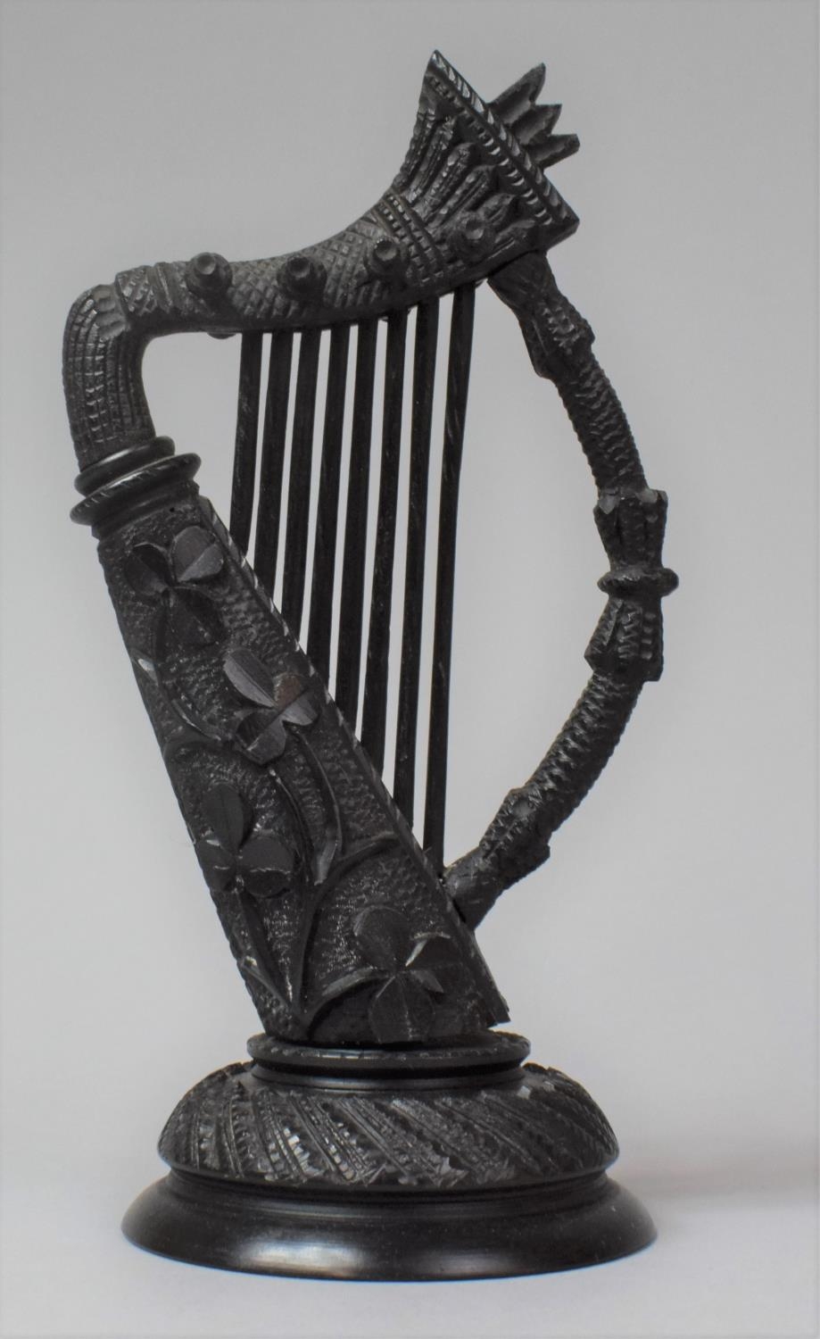 A Large Irish Carved Bog Oak Item in the Form of a Harp, 18cm high