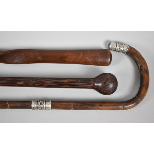 A Silver Mounted Bamboo Walking Cane, Twisted Wood Cane and ... | Barnebys