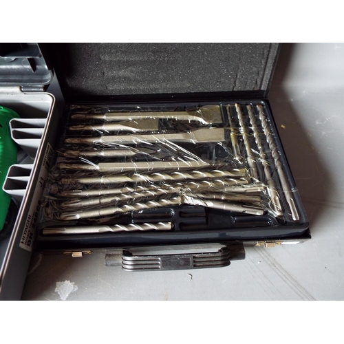 Hitachi KOKI 24mm rotary hammer drill plus a new set of drill bits.