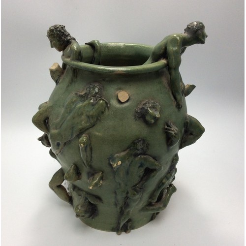 An interesting green glazed 'grotesque' pottery vase modelle... | Barnebys