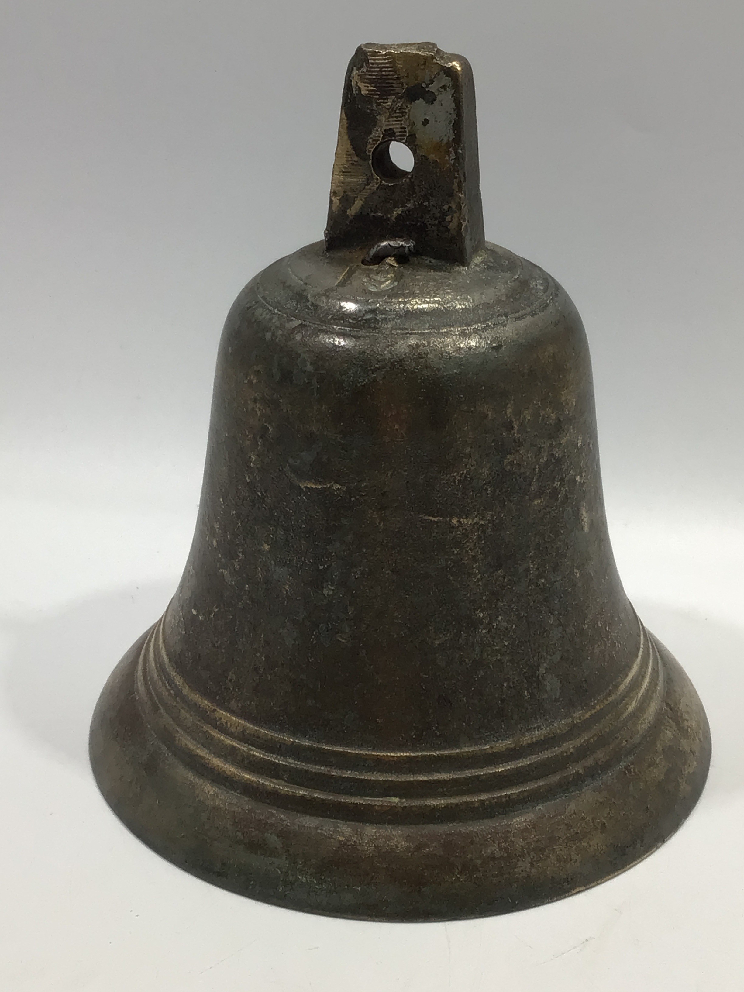 A 19th century bronze bell and clapper marked ‘19’ to top of bell ...