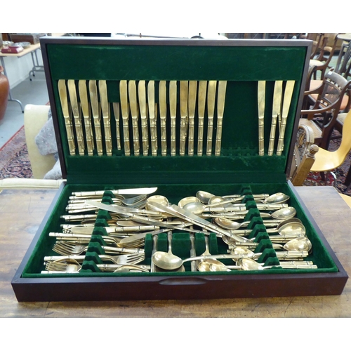 An Asian brass canteen of flatware and cutlery with bamboo e... | Barnebys