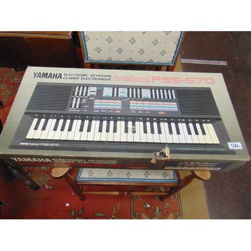 Boxed Yamaha P55 - 570 electric keyboard , and a folding sta... | Barnebys
