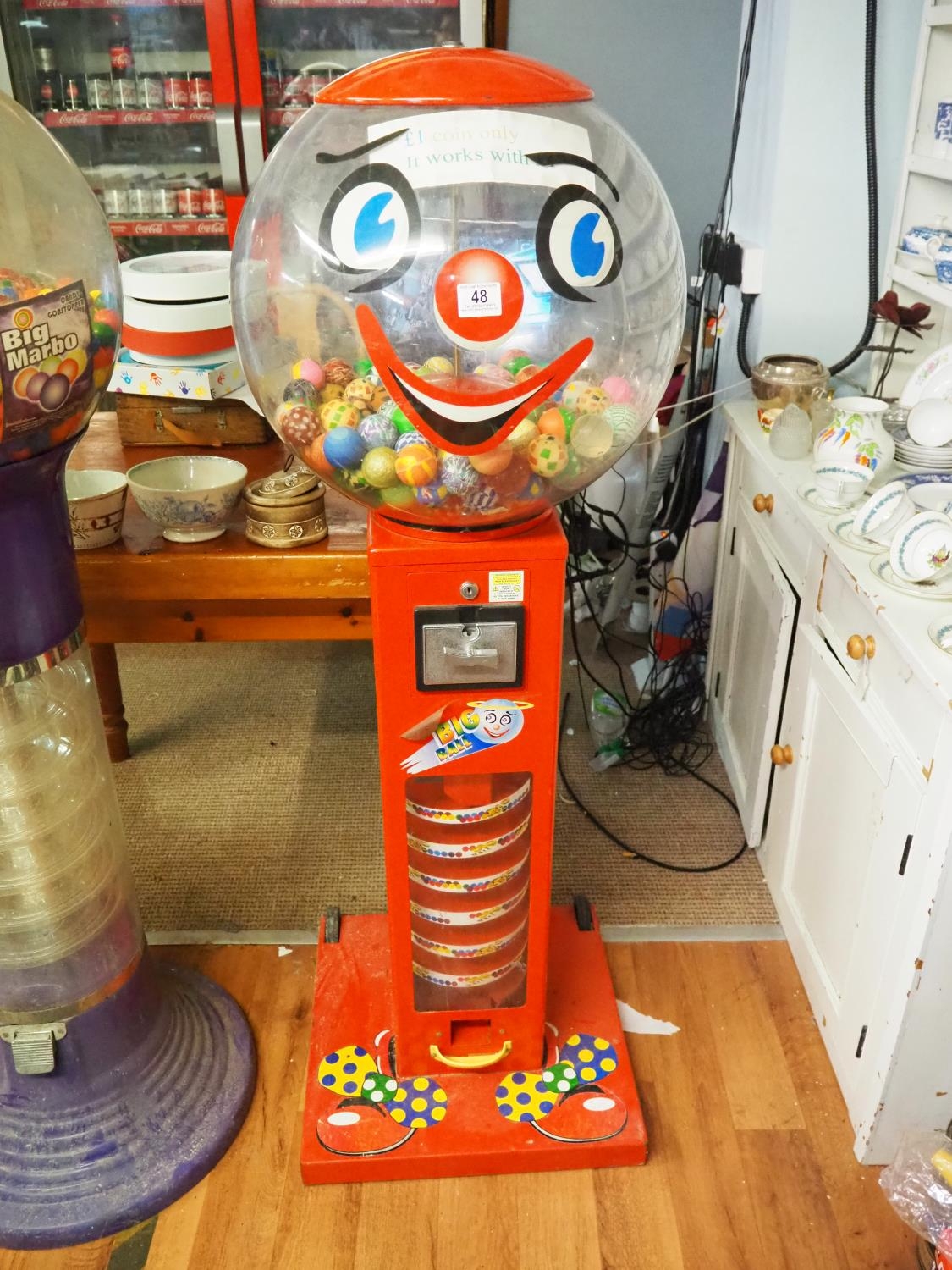 A large 'Big Ball' coin operate gumball machine.