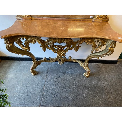 A reproduction console table with brown marble top, on carve... | Barnebys