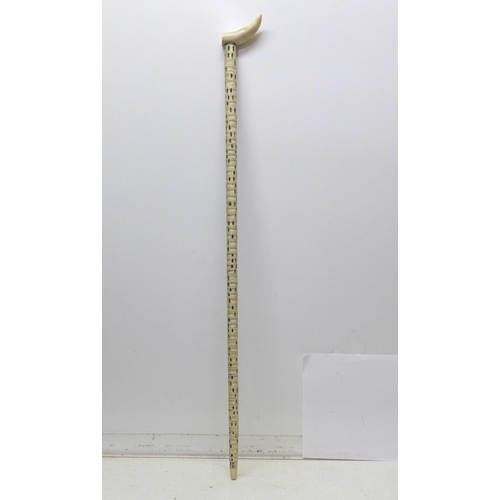 A vertebrae cane, with a marine tooth handle and part tooth ... | Barnebys