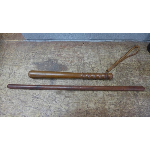 A Police truncheon and a leather covered swagger stick | Barnebys