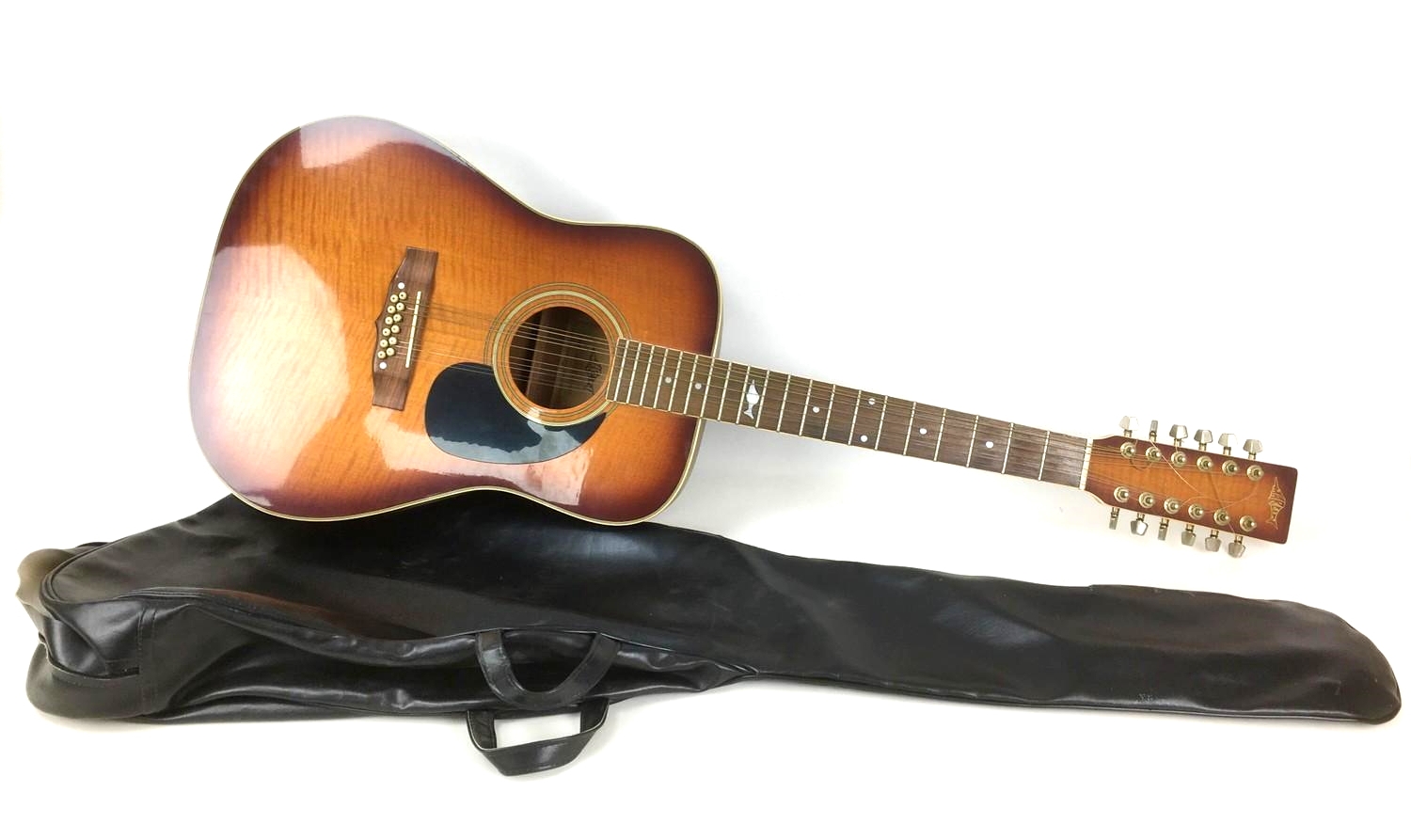A Marlin 12 string acoustic guitar, model number MF2-7-12, with soft case.