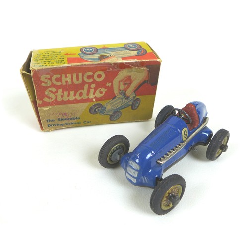 A Schuco Studio tinplate clockwork model racing car, 'The St... | Barnebys