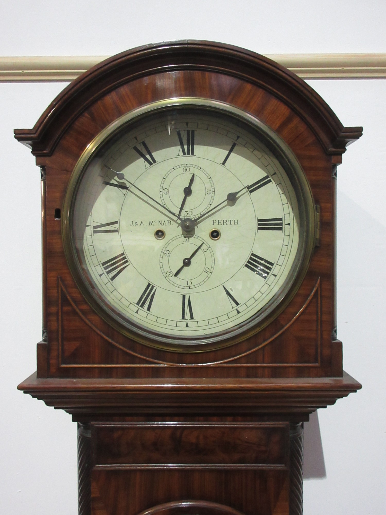 An early 19th Century Longcase Clock having circular white enamel dial ...