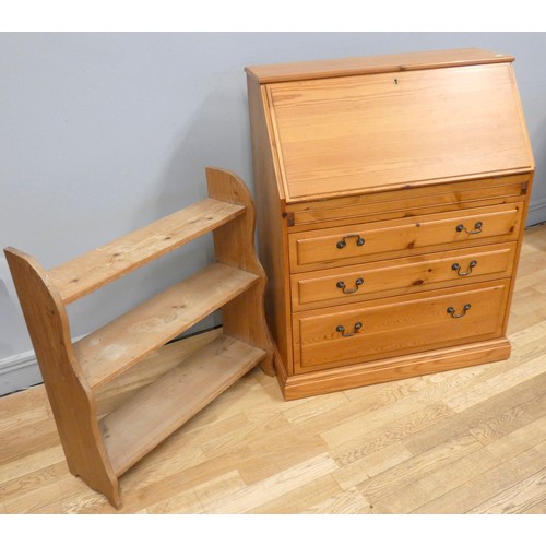 A Younger pine bureau with hinged door, opening to reveal a ... | Barnebys