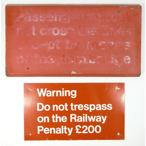 Two metal railway signs, 'Warning do not trespass on the railway ...