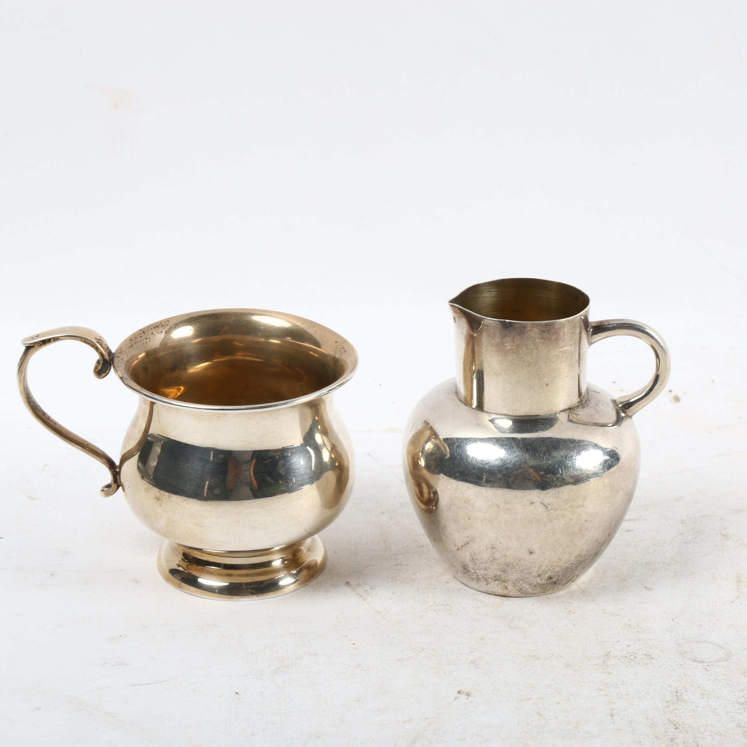 A small silver Jersey cream can, and a small silver cup (2)