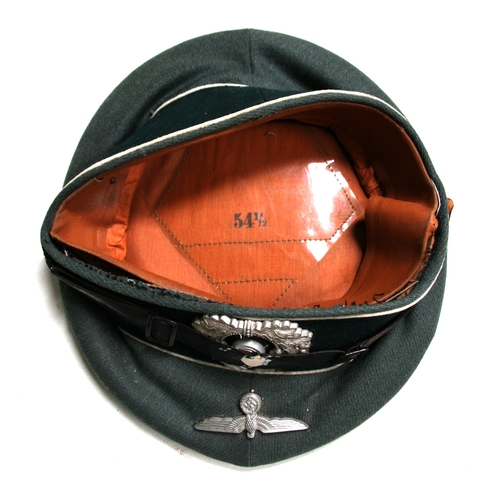 A WWII German Nazi peaked cap, dated 1937.Condition Report Leather peak ...