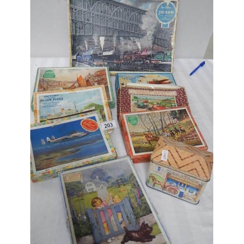 A quantity of vintage wooden jigsaw puzzles.