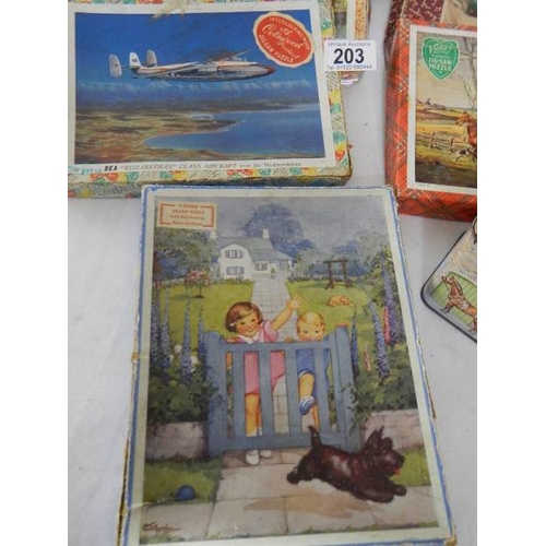 A quantity of vintage wooden jigsaw puzzles.