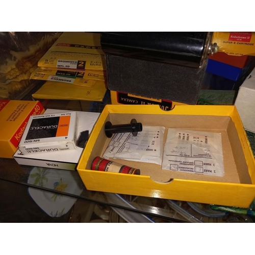 A 20th century pull out camera with early film and paper