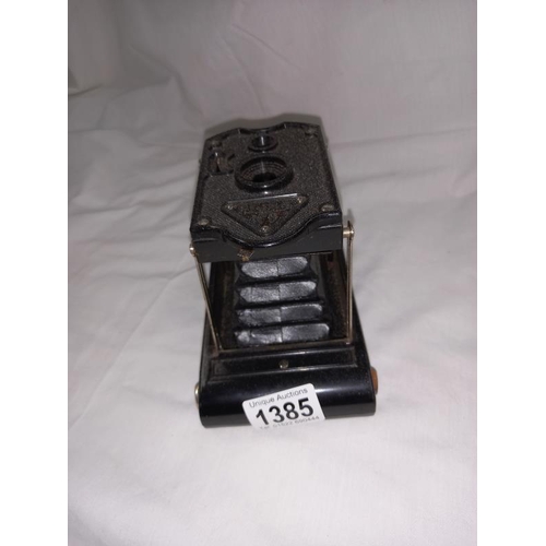 A 20th century pull out camera with early film and paper