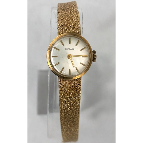 A 9ct gold Garrard ladies dress watch with bark effect strap... | Barnebys