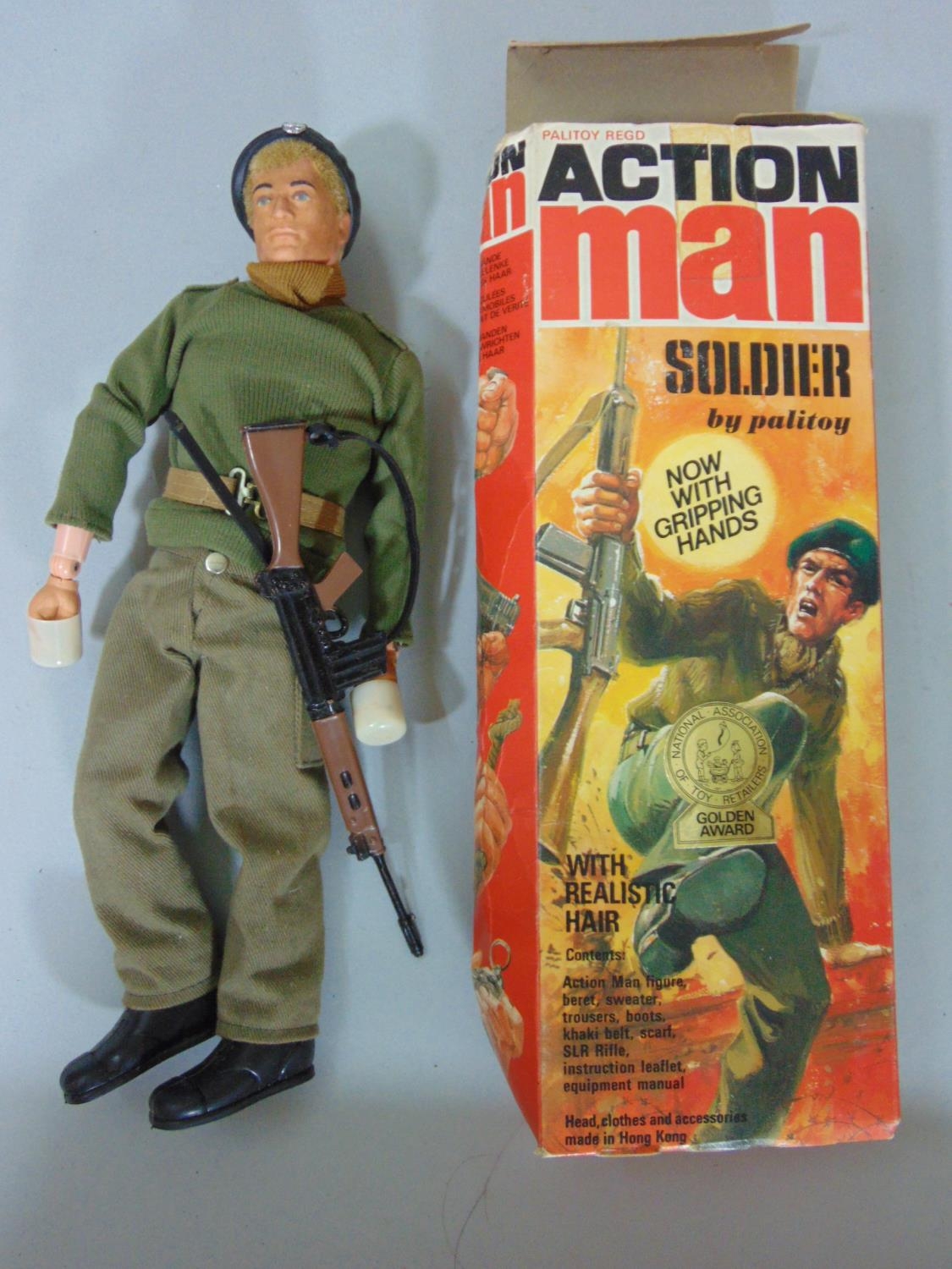Boxed Action Man soldier with gripping hands and rifle, a similar ...
