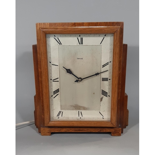 A Ferranti mantel clock in an art deco style, the oak case e... | Barnebys