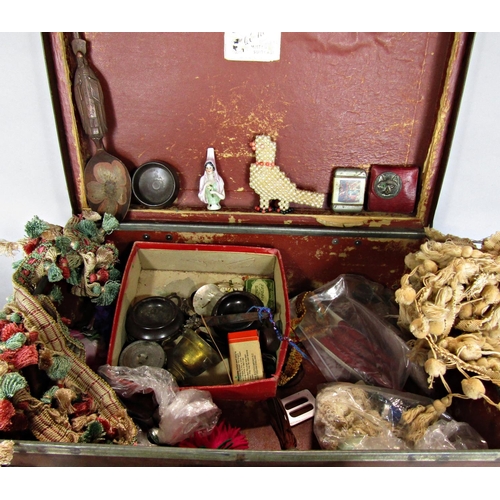 A small vintage suitcase 40cm wide, containing several metres of ...