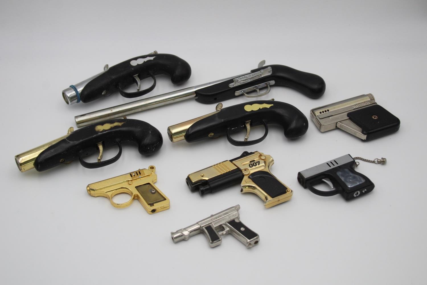 9 x Assorted Gun Shaped Cigarette LIGHTERS Inc Vintage, 007, Miniature Etc