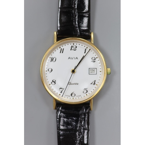 A gentleman's modern 9ct gold Avia quartz wrist watch, on associated ...