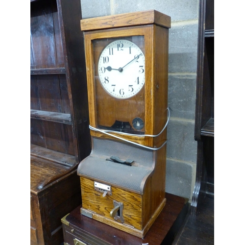 A vintage oak-cased electric wall factory time recorder cloc... | Barnebys