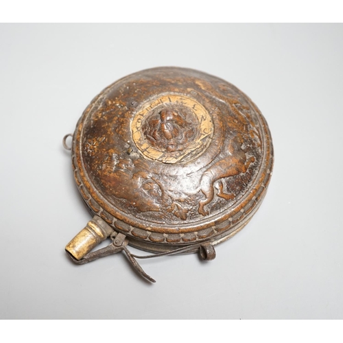 A circular wooden powder flask 17th century, carved with bea... | Barnebys