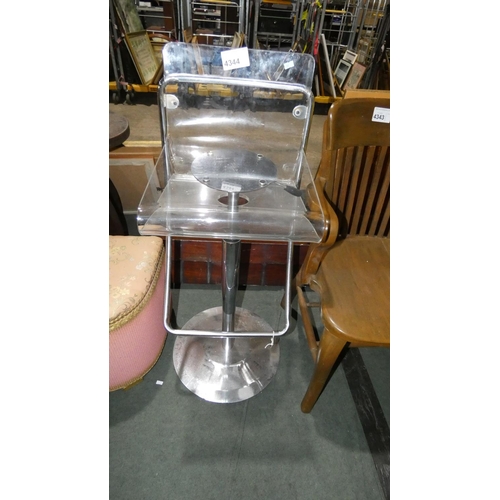 A 1980s vintage chromium bar stool with a moulded perspex seat