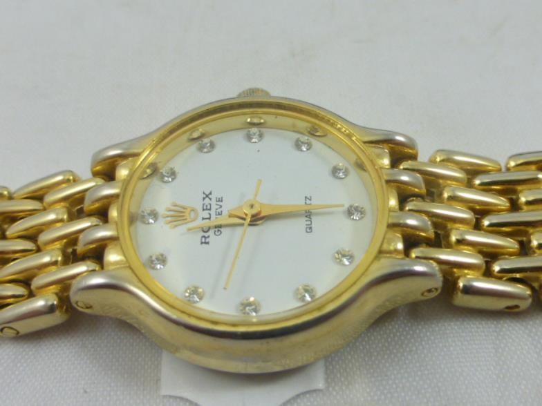 Ladies Replica Rolex Geneve Gold Tone Watch with Jewel Decoration
