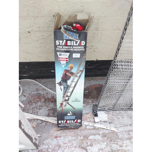 A boxed pair of Abru Stabilad ladder safety legs | Barnebys