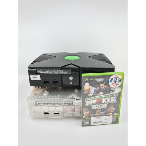 Two original Xbox game consoles, one crystal and one black h... | Barnebys