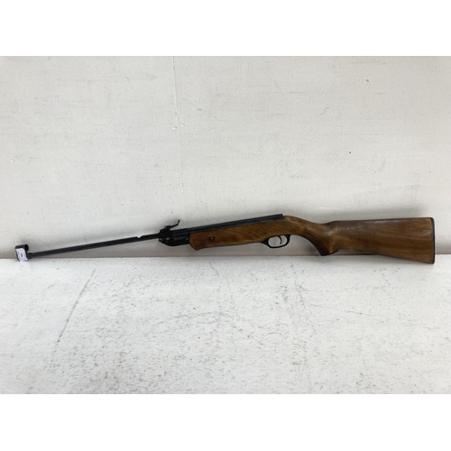A vintage Vostok IZH-38 air rifle with wooden stock | Barnebys