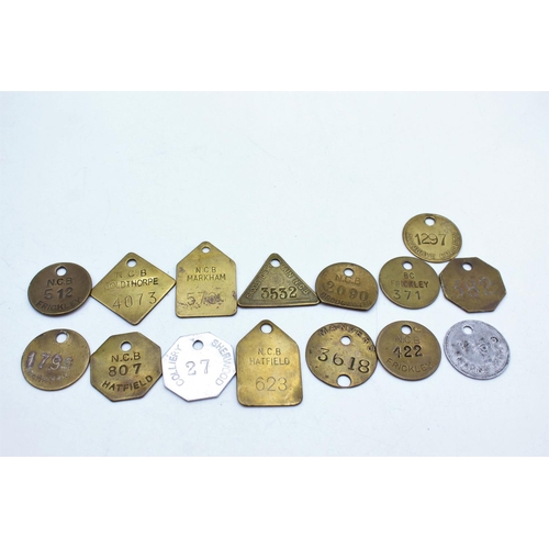 Fifteen vintage brass miners and colliery pit check tags