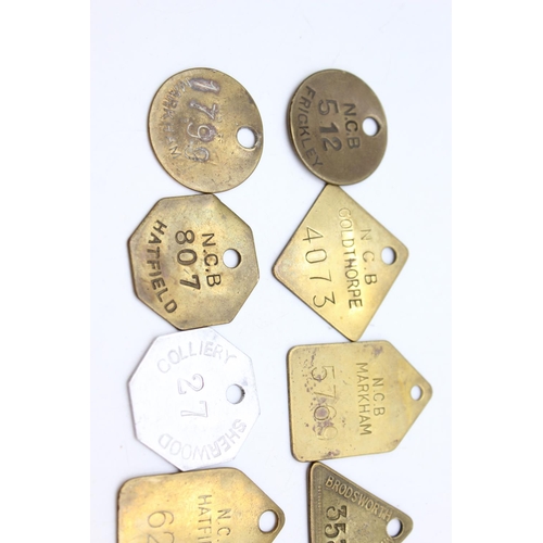 Fifteen vintage brass miners and colliery pit check tags