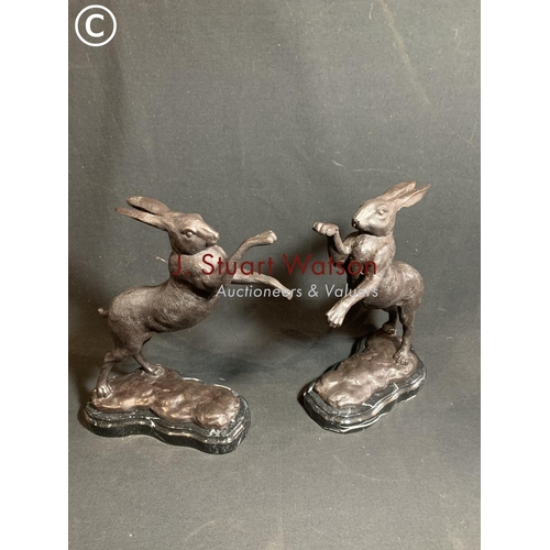 Pair Bronze boxing hares on plinths, height 29cms | Barnebys
