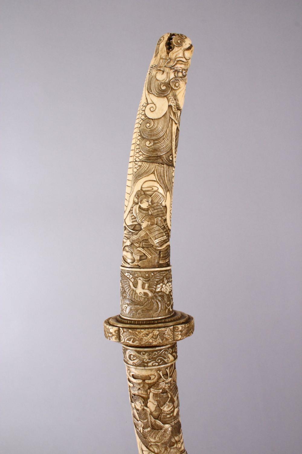 A LARGE JAPANESE MEIJI PERIOD CARVED SECTIONAL IVORY KATANA / SWORD ...