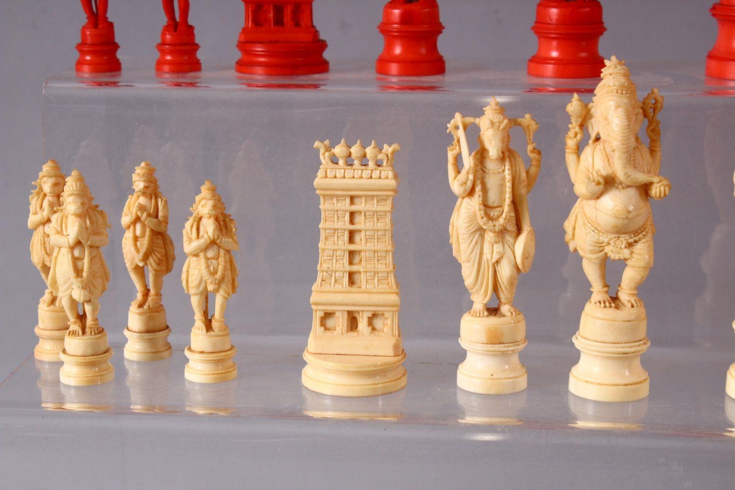 AN EARLY 20TH CENTURY IVORY AND STAINED IVORY INDIAN CHESS SET, carved ...