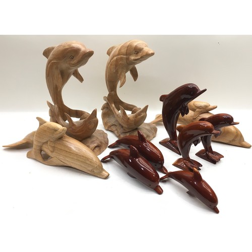 Large collection of carved wood dolphins. 10 in all. largest... | Barnebys