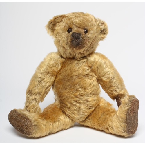 A pre-war Farnell teddy "Archie", with long orange plush, bu... | Barnebys